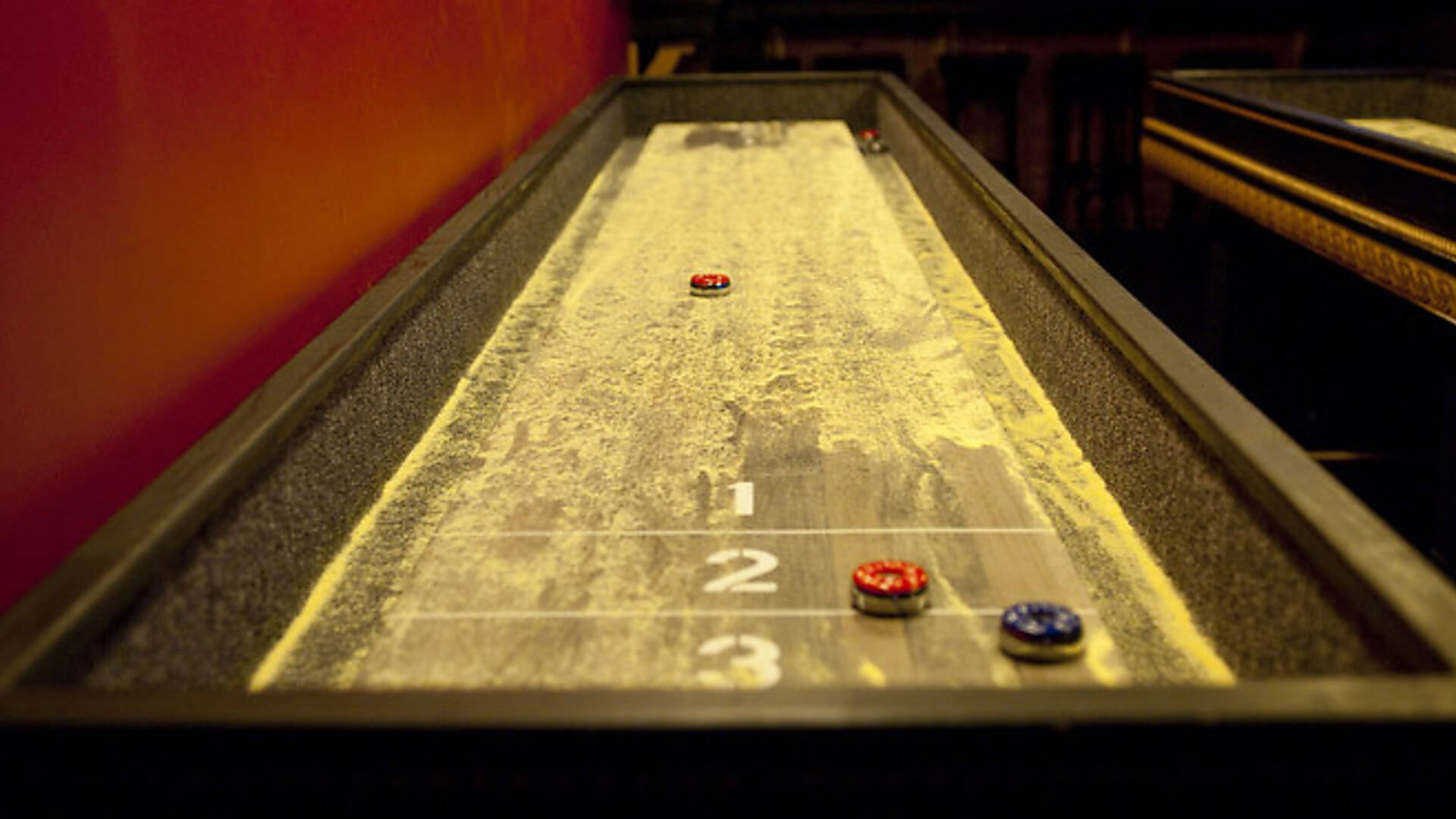 Best bars with games in NYC including arcade bars and bowling