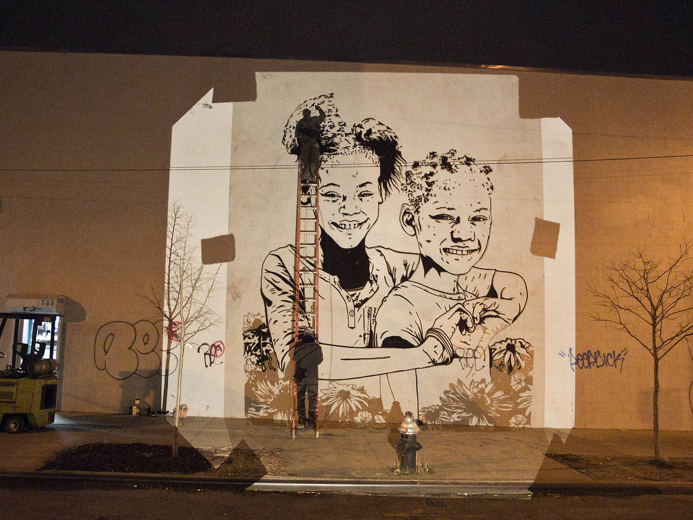 Street artists Chris Stain and Billy Mode paint a mural (video)