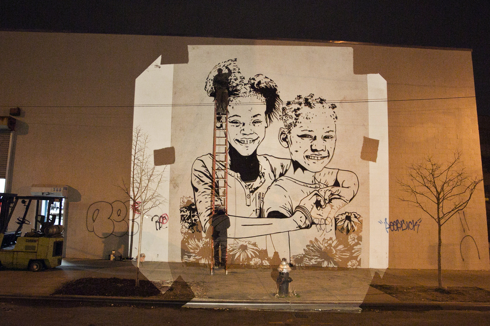 Street artists Chris Stain and Billy Mode paint a mural (video)