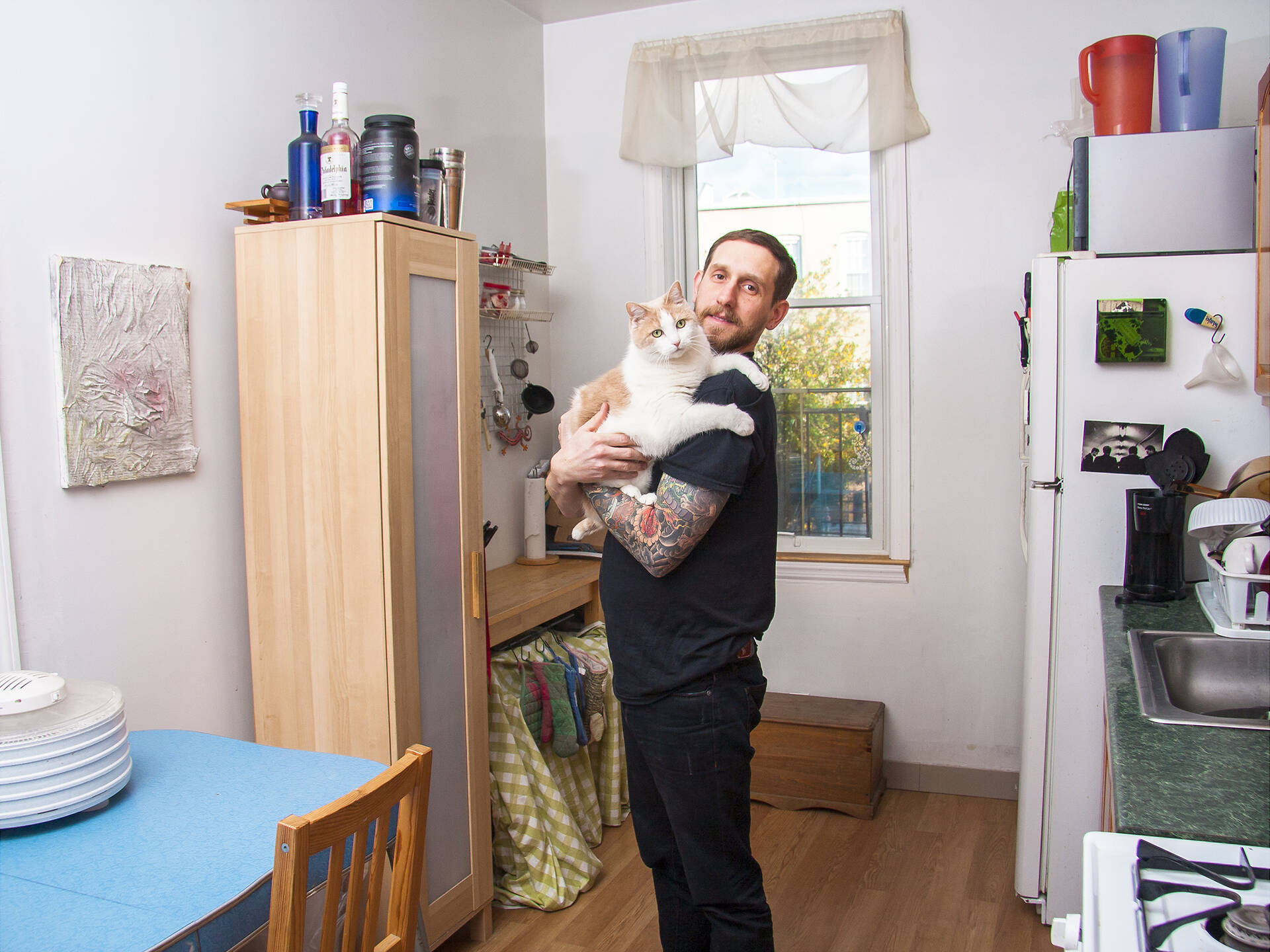 See adorable photos of New York men with their cats