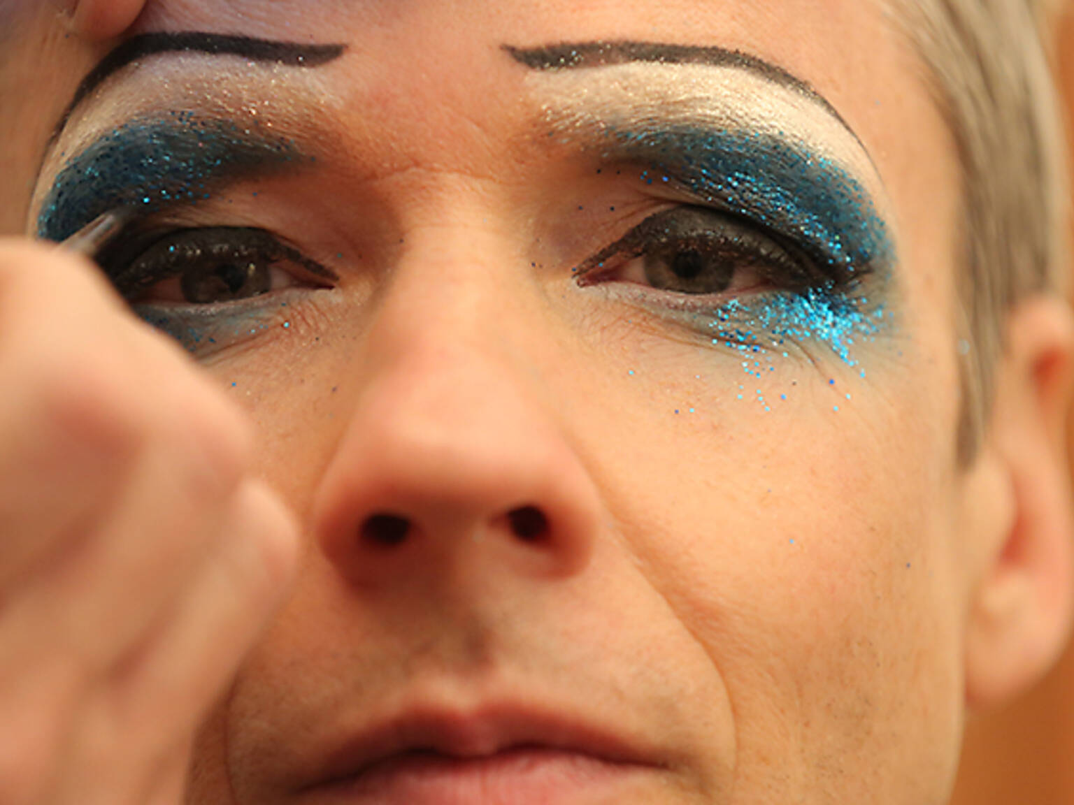 See photos of John Cameron Mitchell's makeover into Hedwig