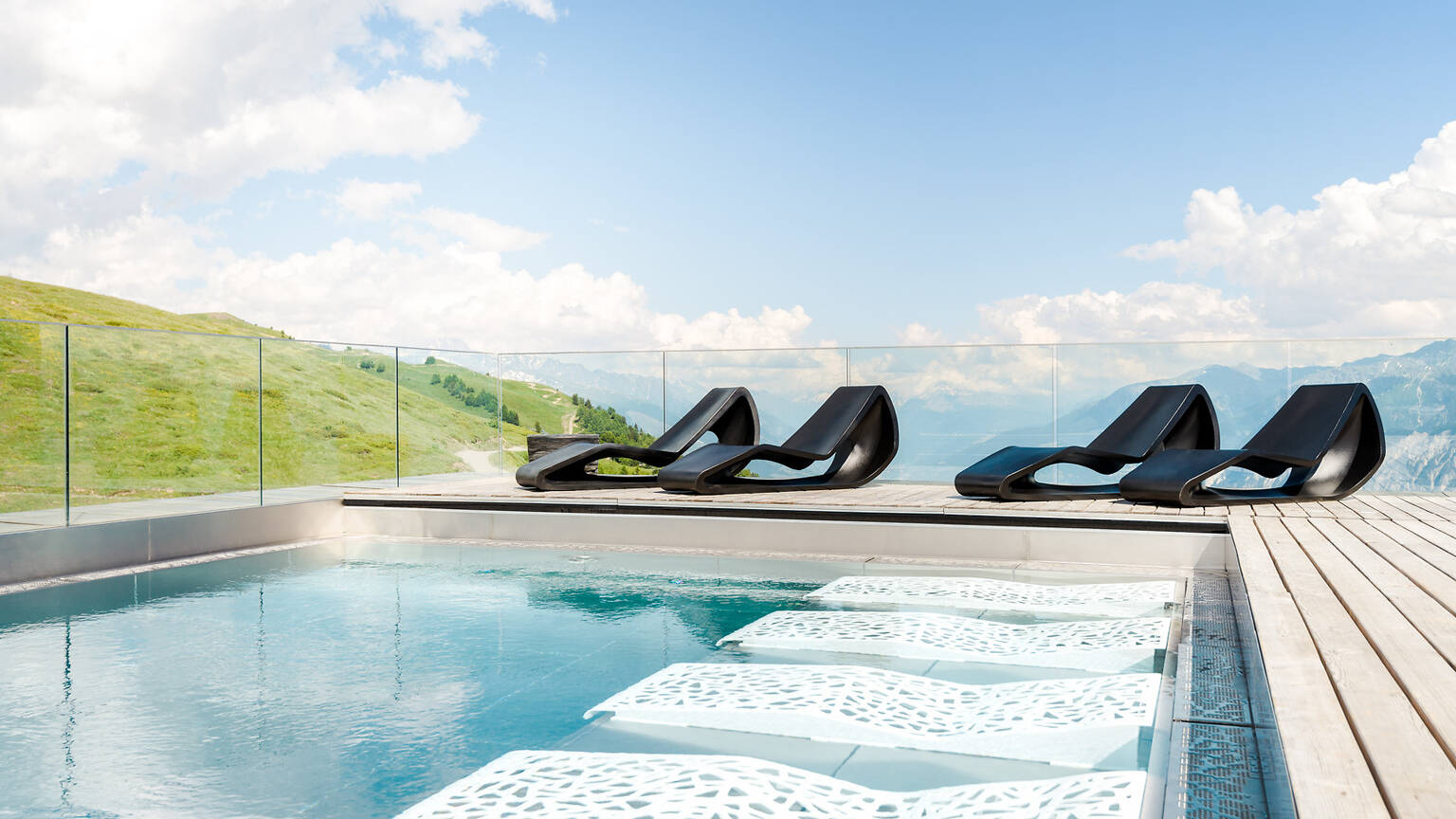 The best hotels with outdoor pools for a Swiss summer staycation