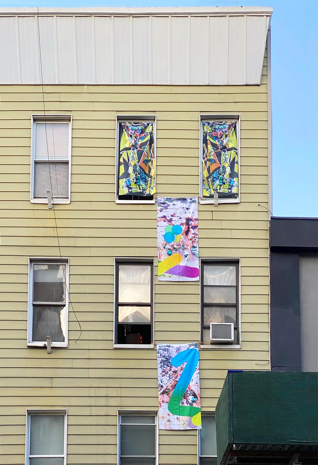 This artist is hosting an exhibition in her apartment windows