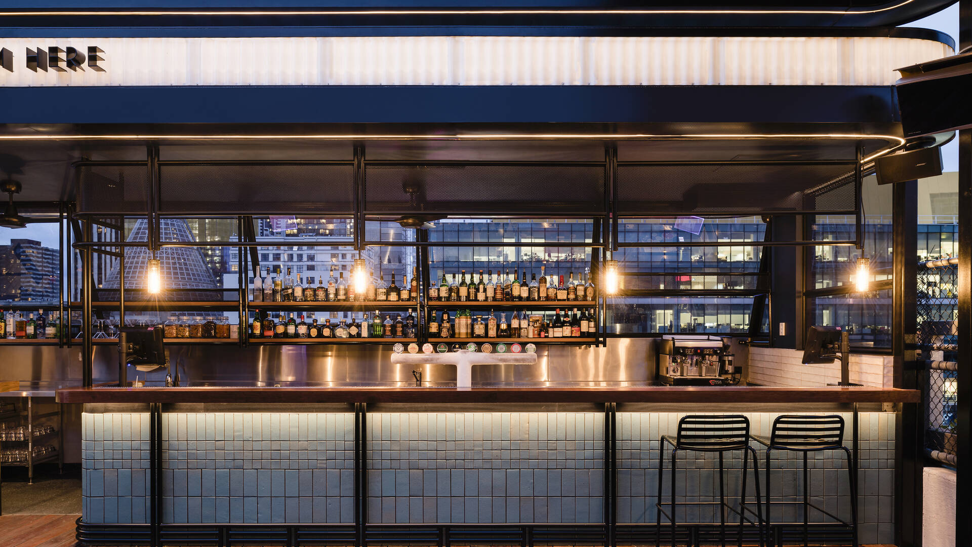 Visit Rooftop Bar on the uppermost level of Curtin House