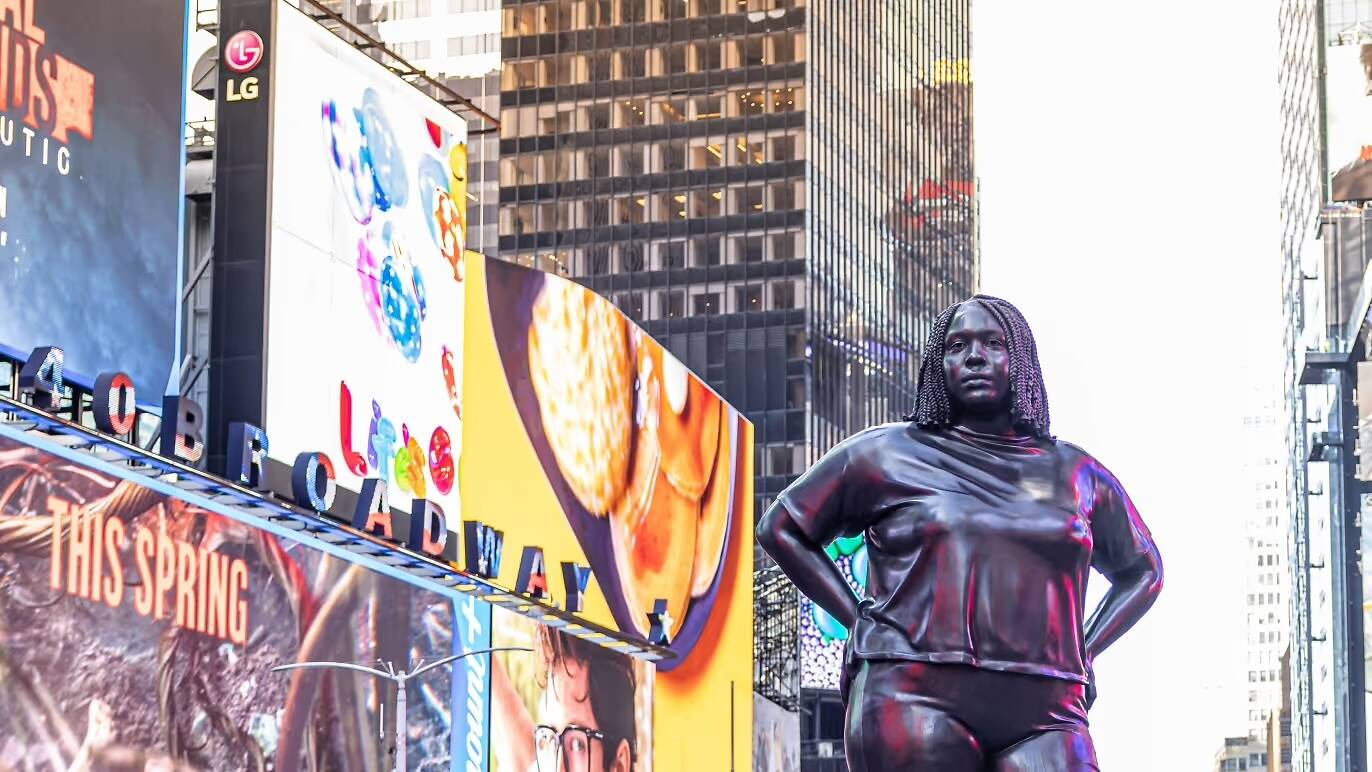 There's a massive bronze sculpture of a woman in the middle of Times ...