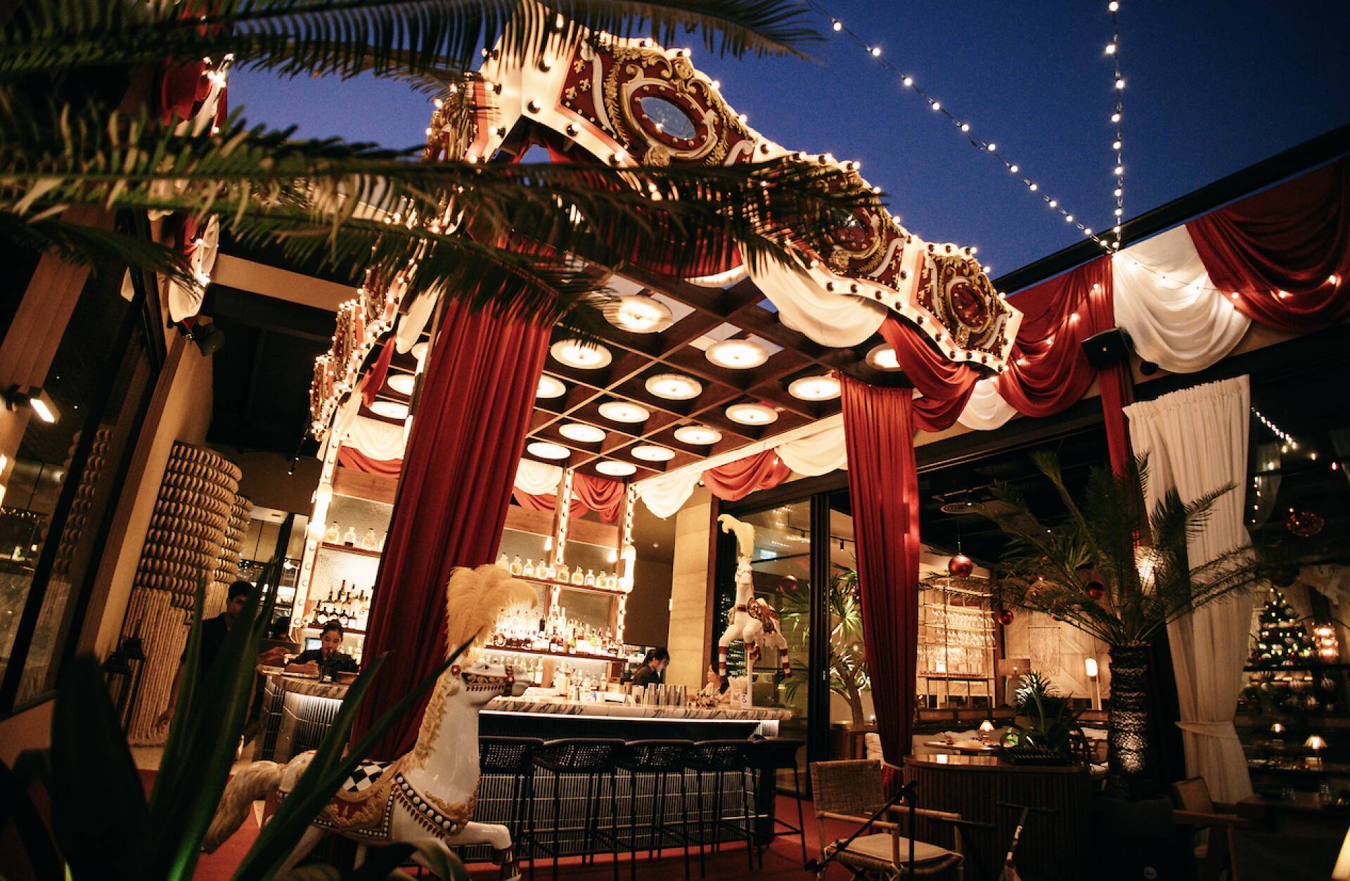 Watch Bou Bou Bar reimagined as carousel warmed by festive lights ...